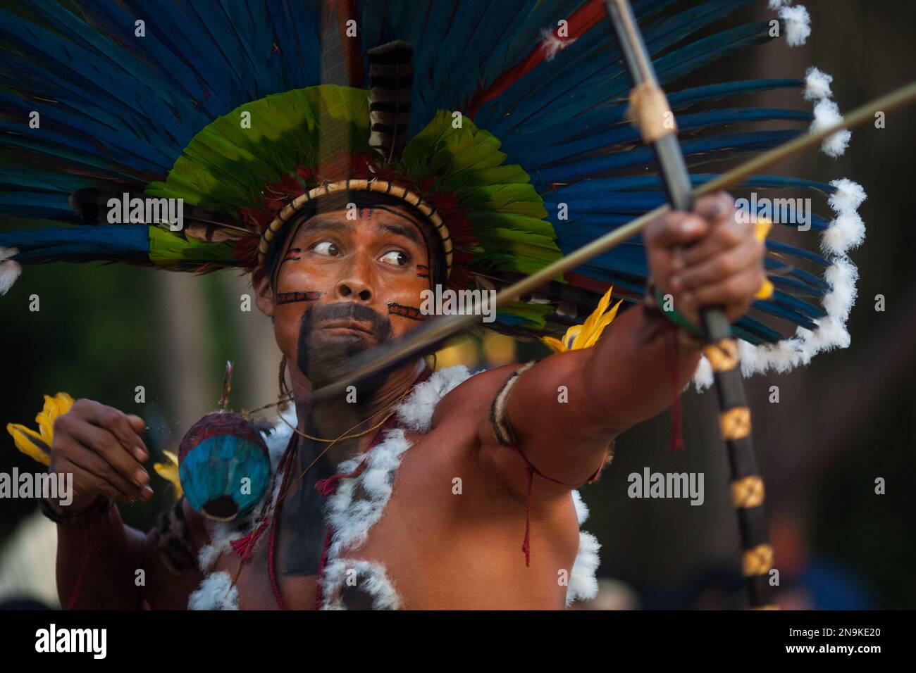 A Bororo tribe member competes in the archery event at the "Jogos ...