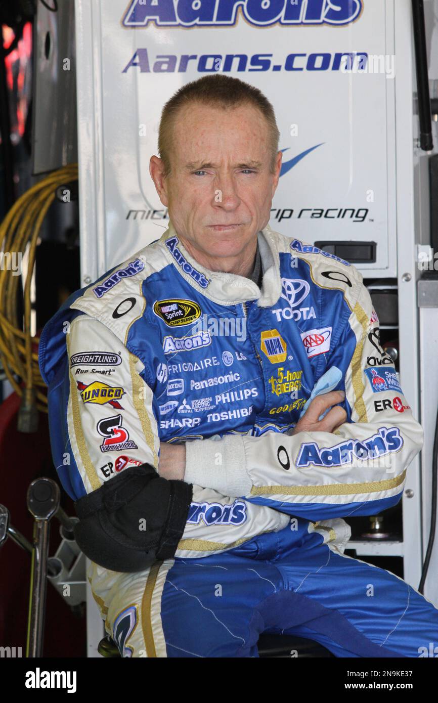 NASCAR driver Mark Martin sits in the garage before the final practice ...