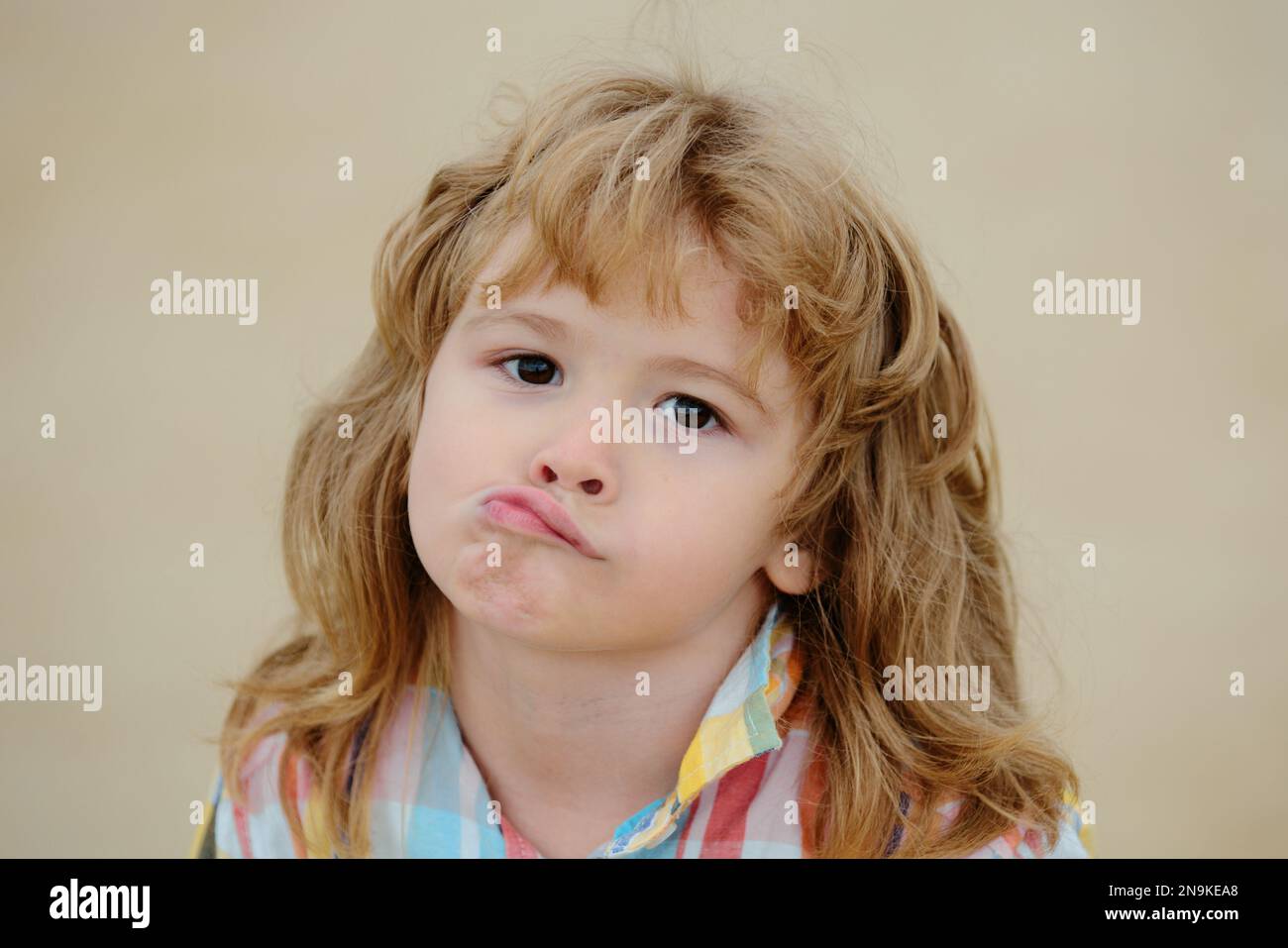 Child emotions. Unhappy confused kid. Childhood. Isolated. Funny boy ...