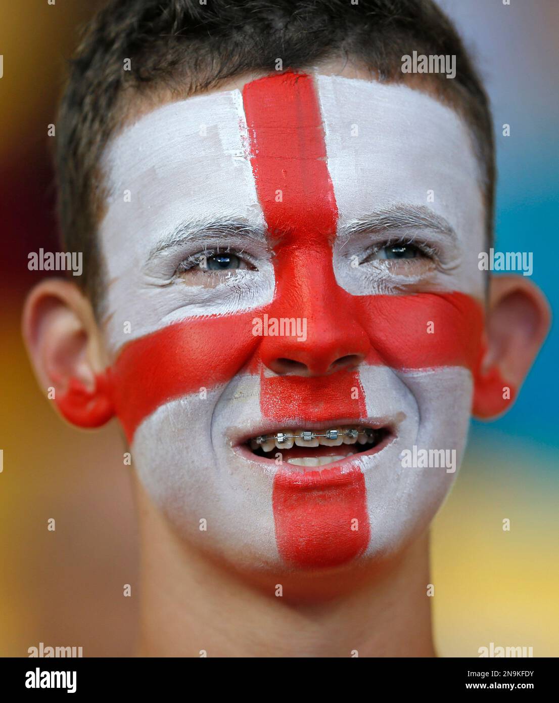 An England fan smiles prior to the Euro 2012 soccer championship Group ...