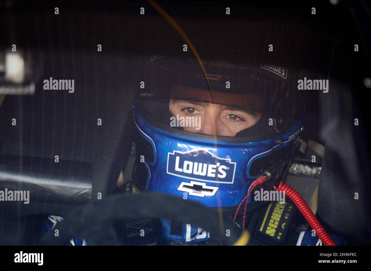 NASCAR Series driver Jimmie Johnson sits in his car before a practice ...