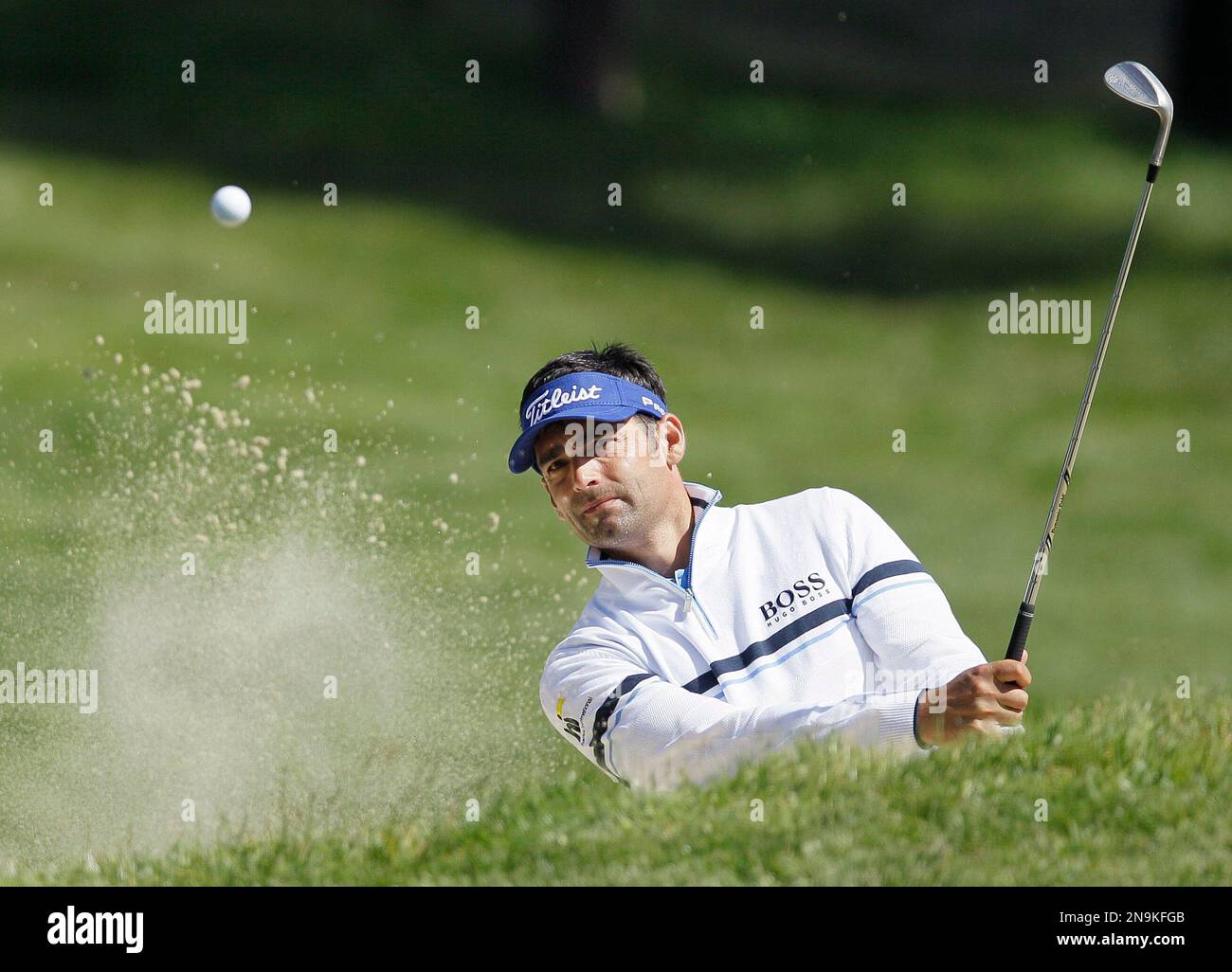 Lee Slattery, of England, hits out of a bunker on the fifth hole during ...