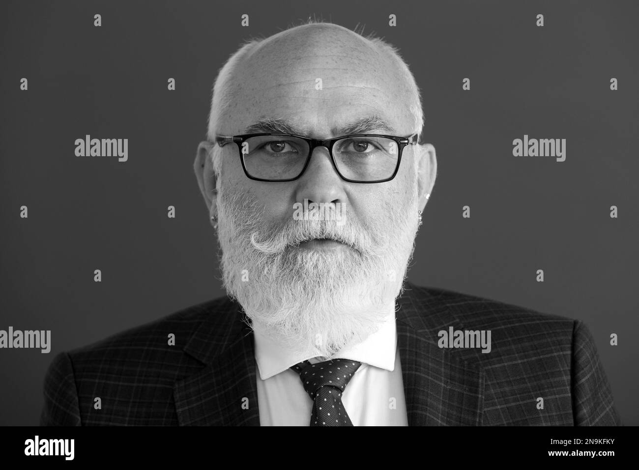 Closeup portrait of senior academic professor on lecture near empty ...