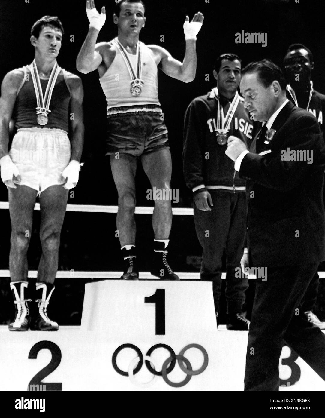 Poland's Jerzy Kulej raises his hands on the podium after receiving the ...