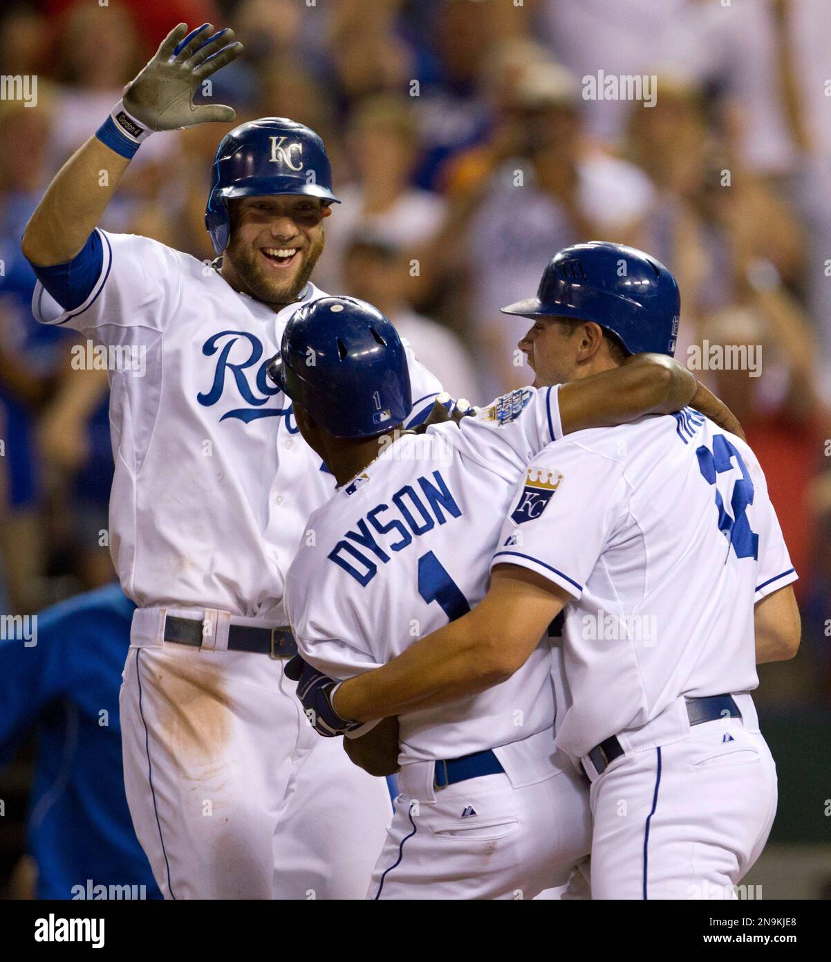 Kansas City Royals' Jarrod Dyson (1) is congratulated by teammates Alex ...