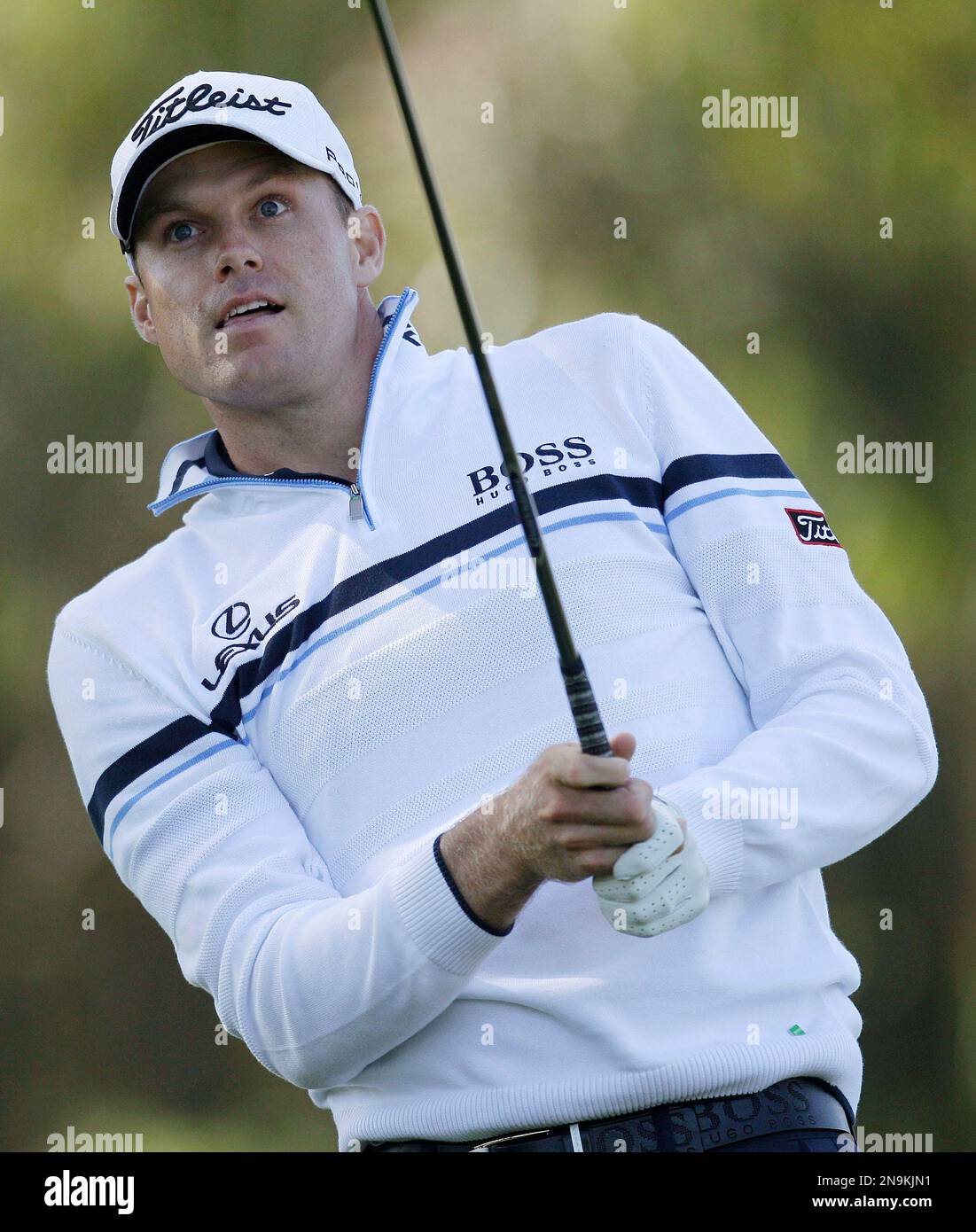 Nick Watney watches his drive on the second hole during the first round ...