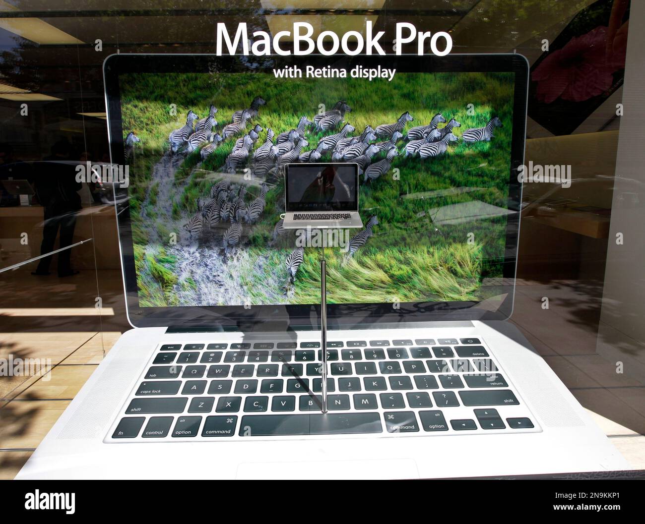 A MacBook Pro with Retina display advertisement is on display at an ...