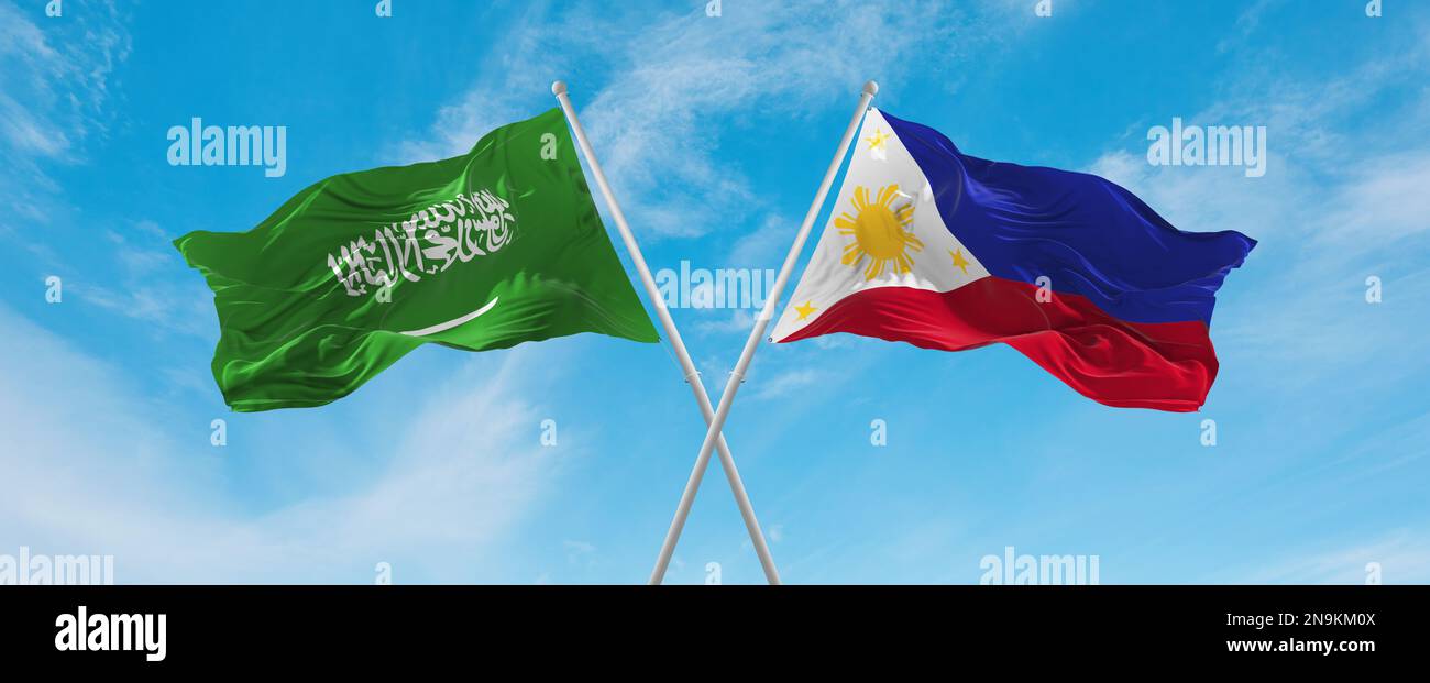 two crossed flags Philippines and Saudi Arabia waving in wind at cloudy ...