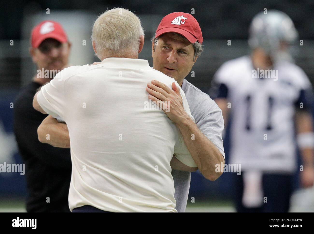 Washington State head football coach Mike Leach, right, hugs Dallas ...