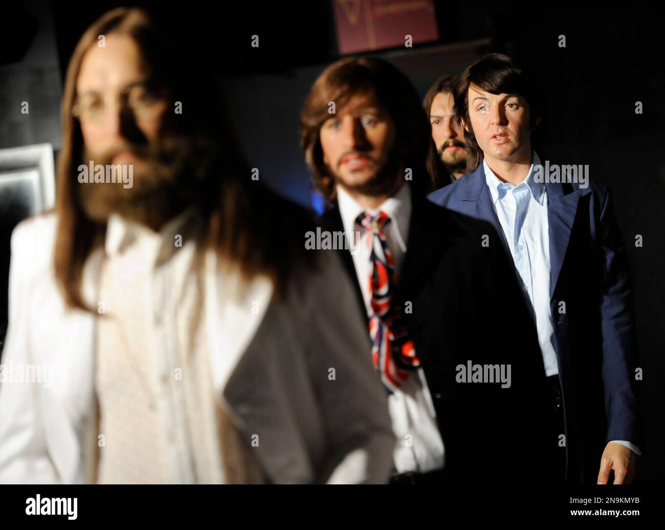 Wax figures representing The Beatles, from left, John Lennon, Ringo ...