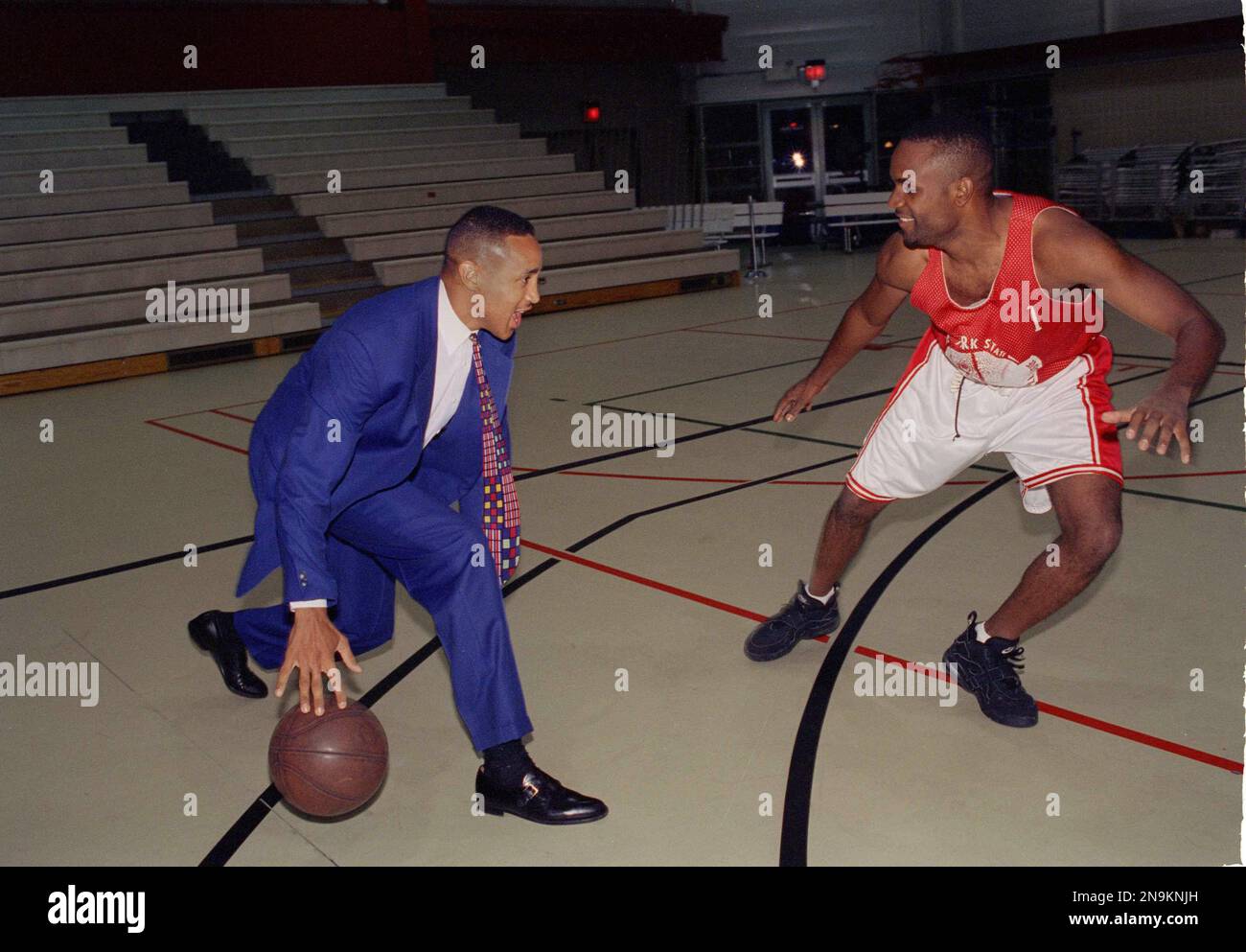 New York Knicks guard John Starks, left, gives Eric Bell, from the ...