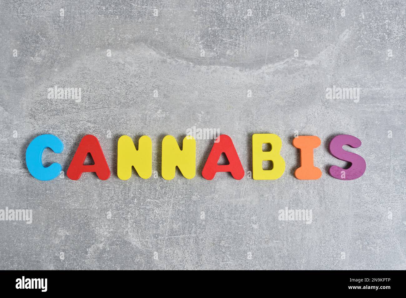 Word cannabis is laid out in letters gray, concrete background Stock ...