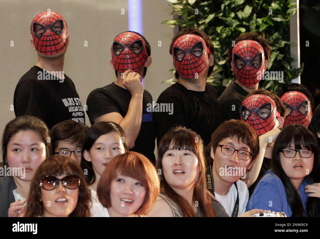 South Korean students wearing masks of Spider Man wait for the arrival ...