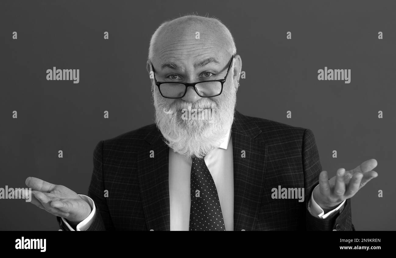 Old teacher open arms in classroom. Happy friendly senior in front of a ...