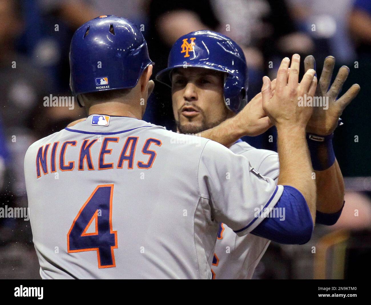 New York Mets' Andres Torres, right, and Mike Nickeas celebrates after ...