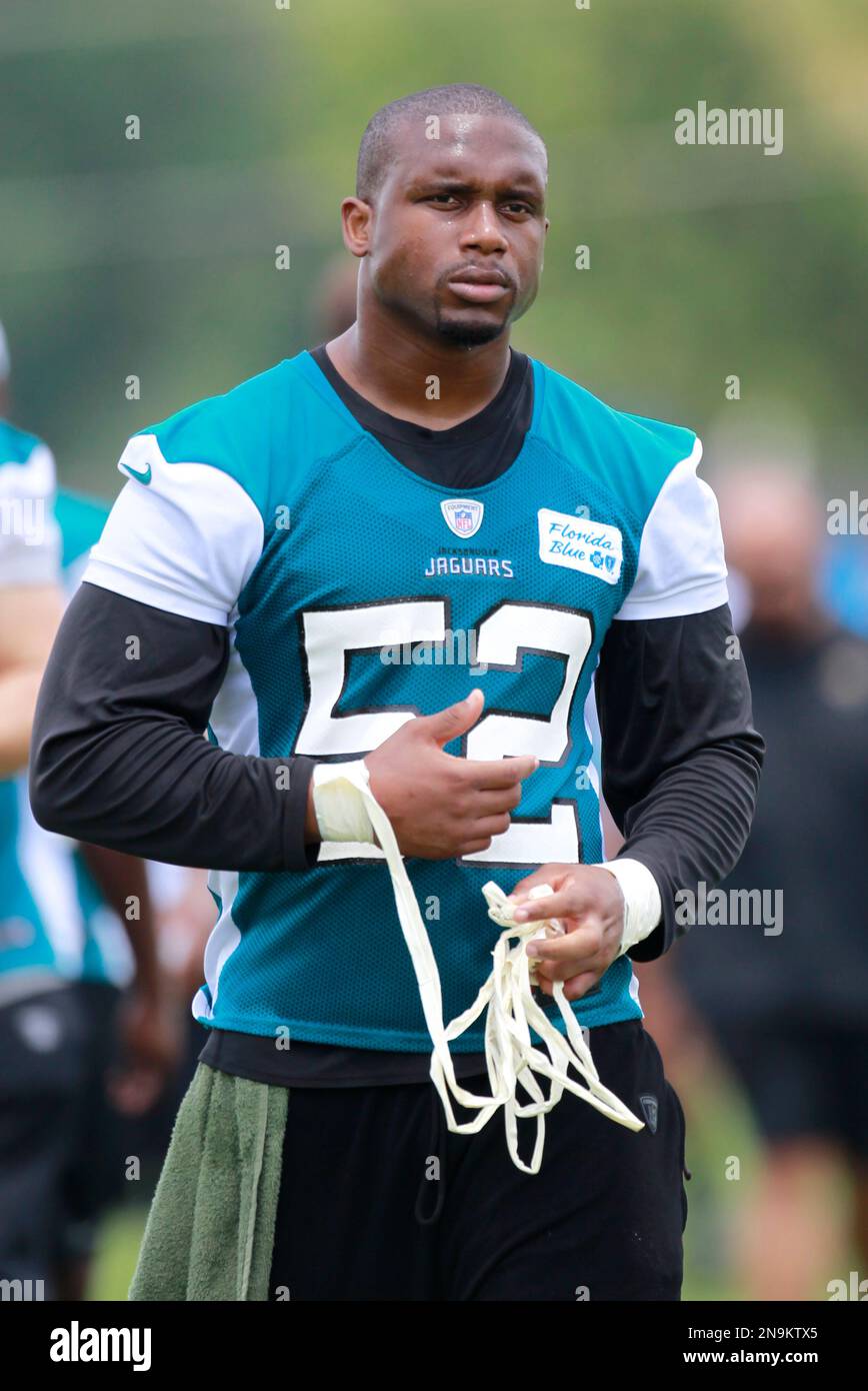 Jacksonville Jaguars linebacker Daryl Smith removes tape from his wrist ...