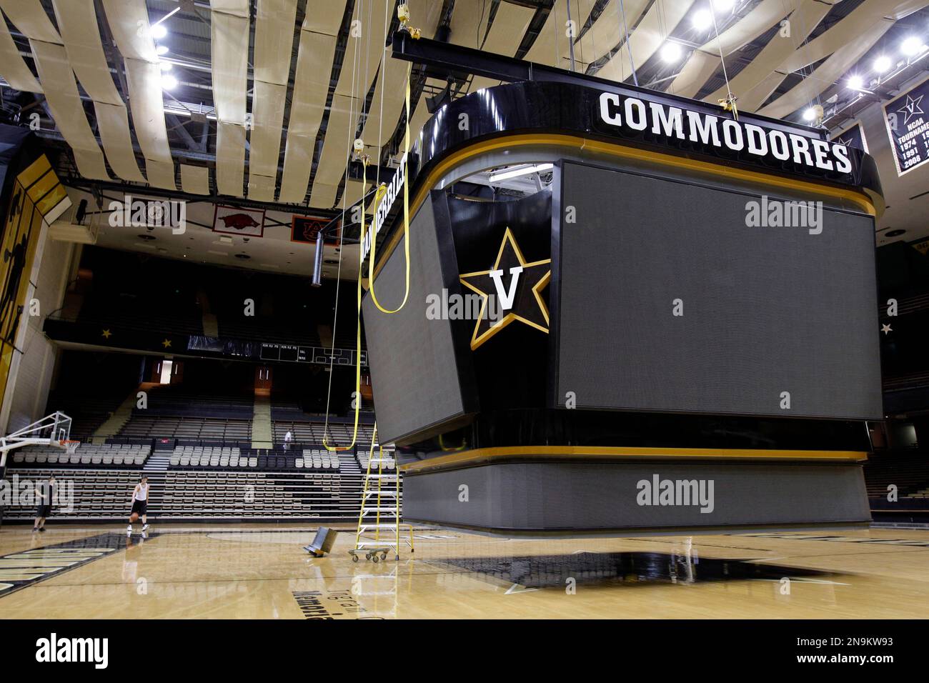 The new scoreboard is lowered to the floor at Memorial Gymnasium at ...