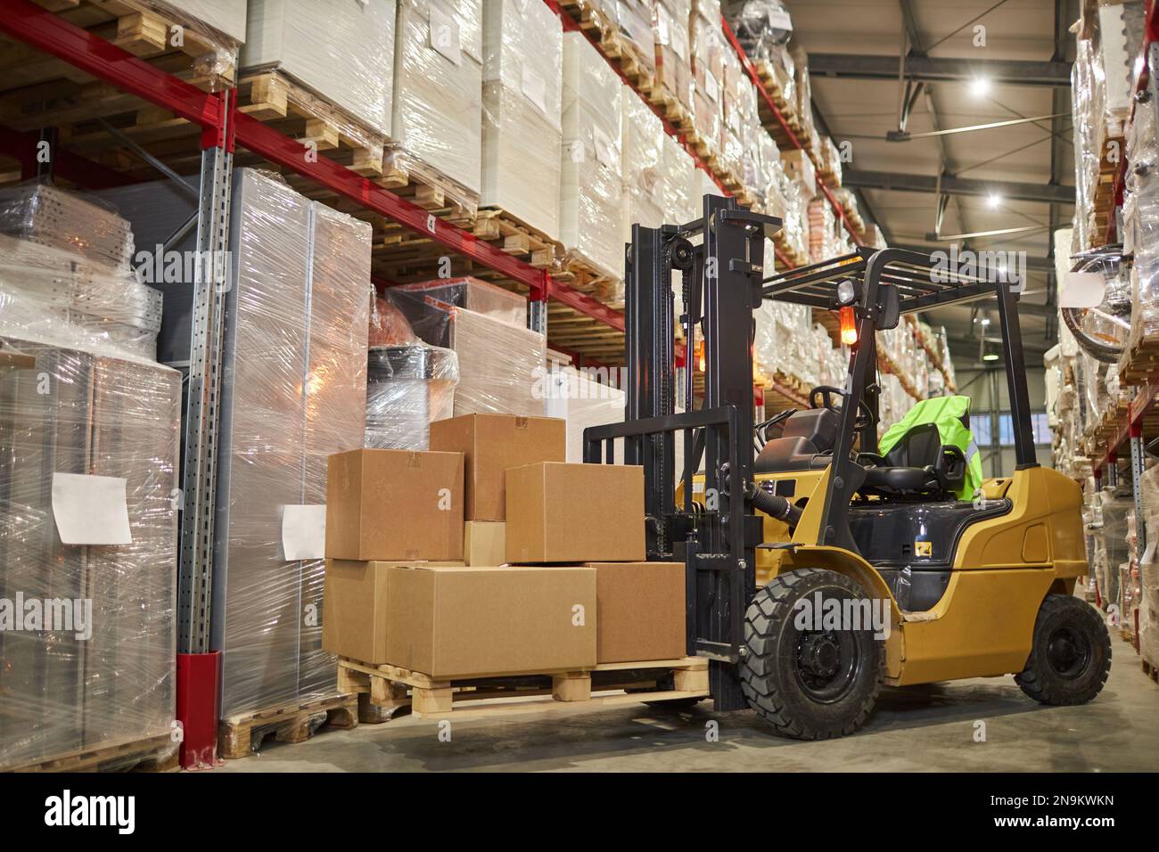 Background image of forklift truck in warehouse interior with tall ...