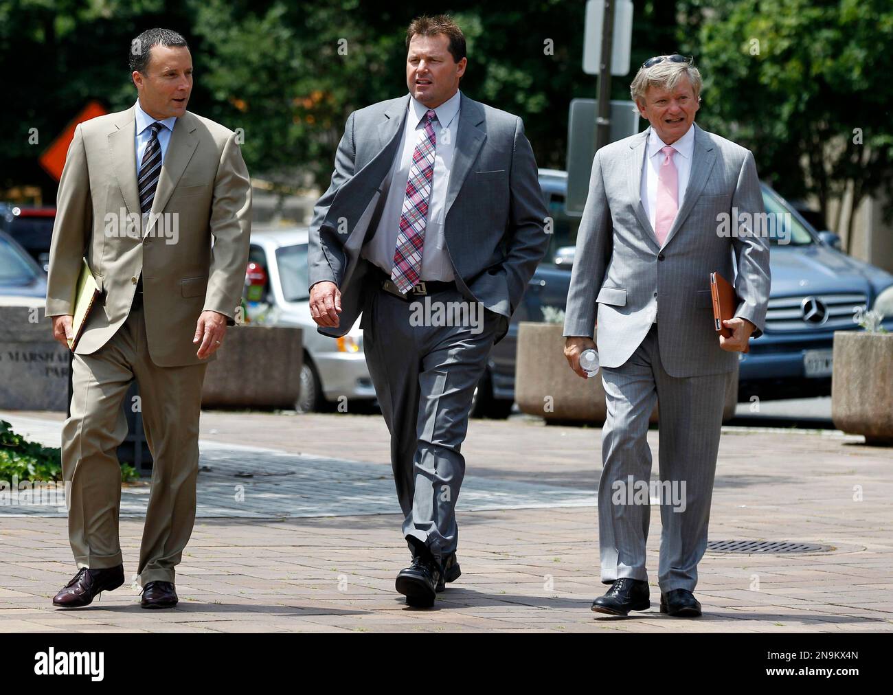Former Major League Baseball pitcher Roger Clemens, center, and his ...