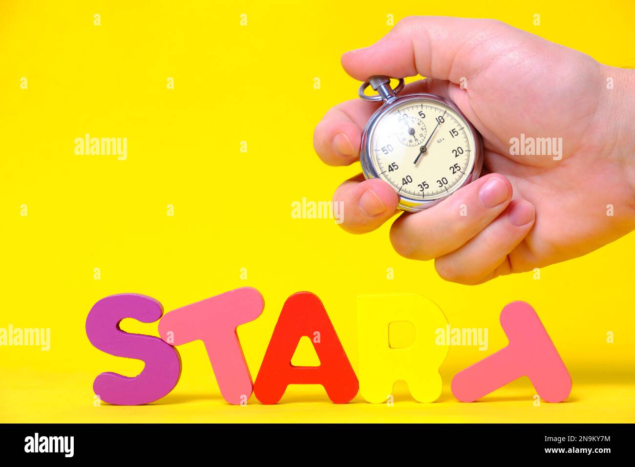 Hand holds sports stopwatch hi-res stock photography and images - Alamy