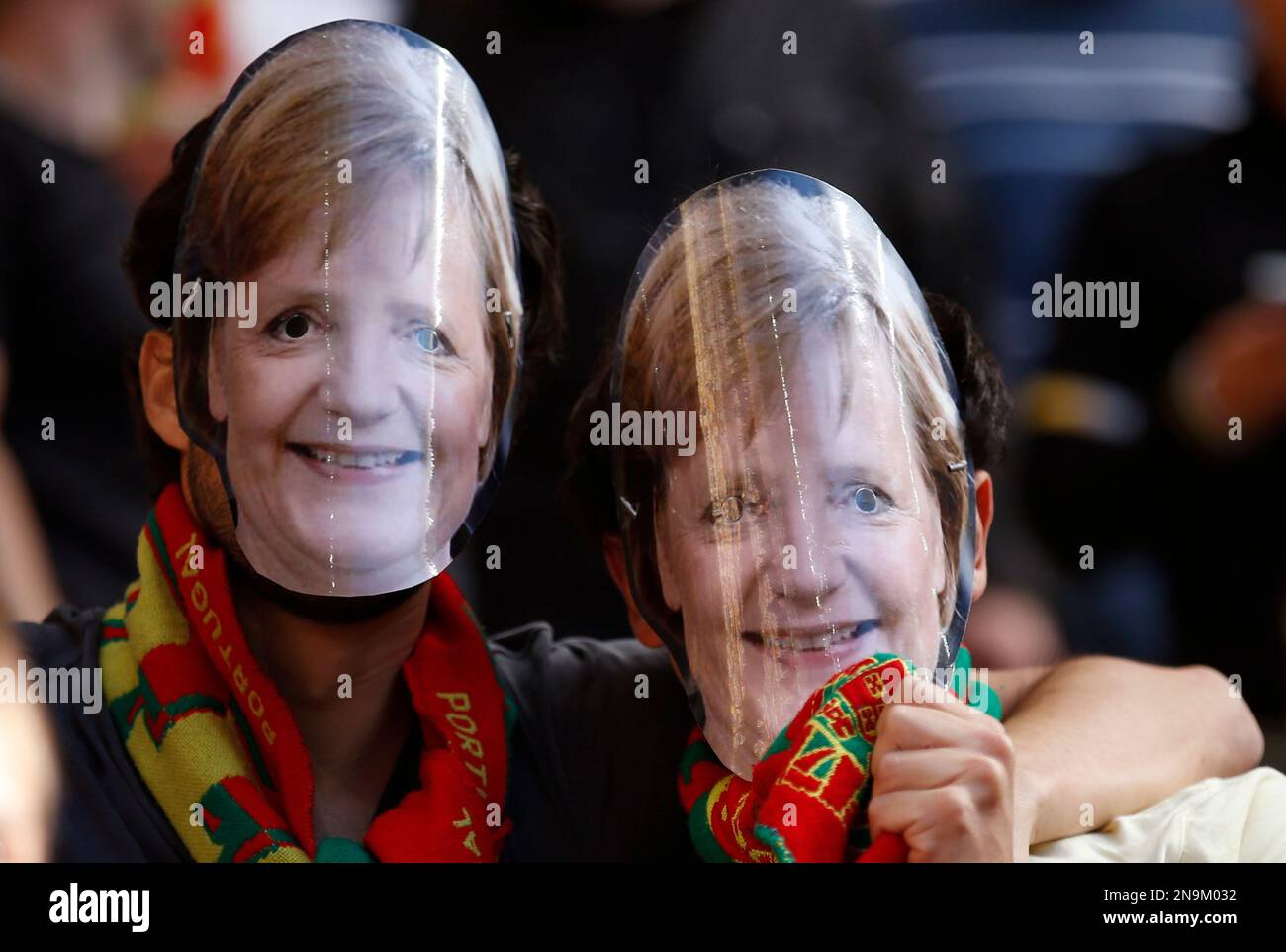 Portugal supporters wearing mask of German chancellor Angela Merkel ...