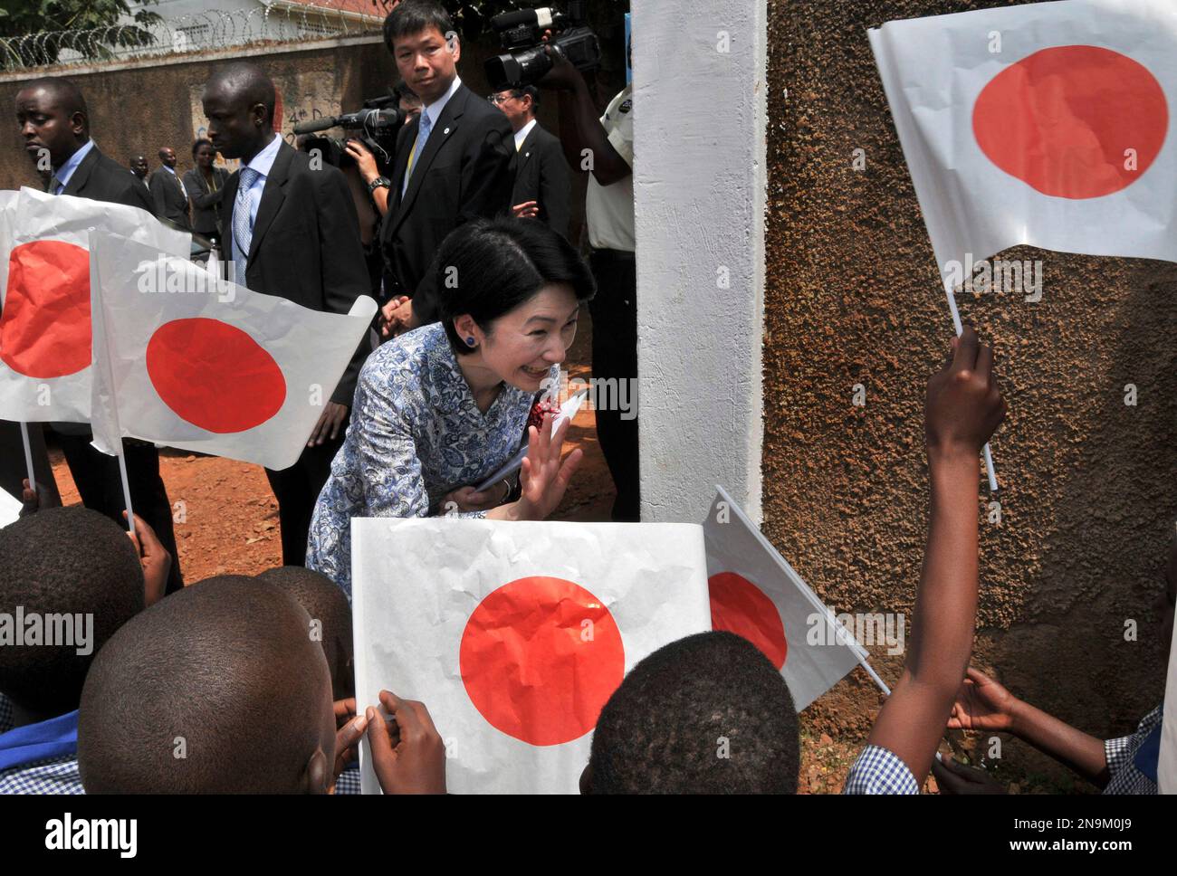 Japan's Princess Kiko, center, waves to Ugandan orphans holding ...