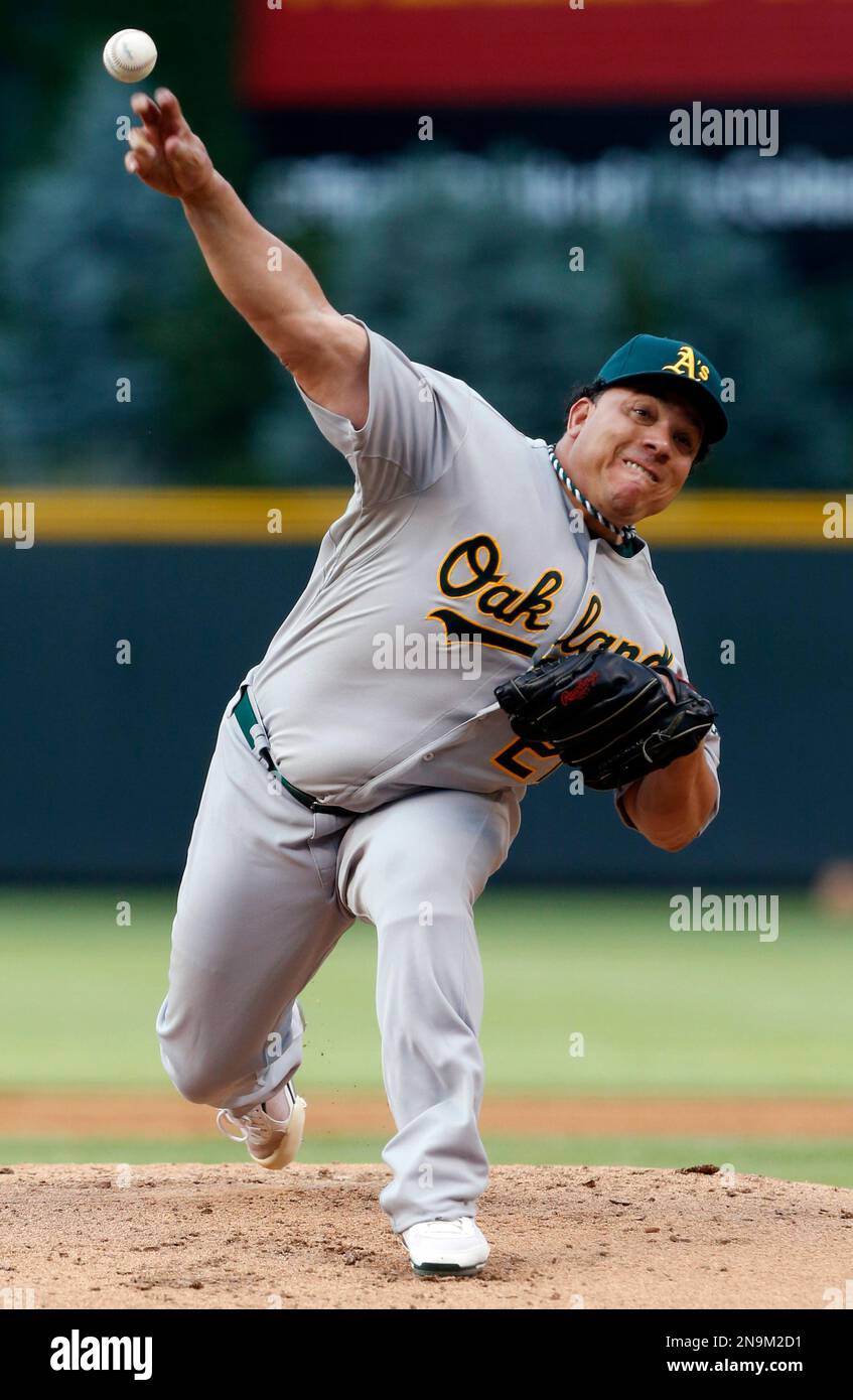 Oakland Athletics starting pitcher Bartolo Colon throws against the ...