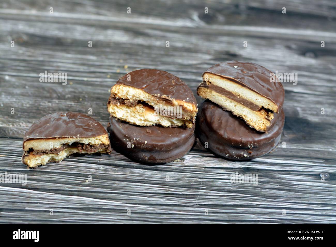 Biscuits filled and coated with natural chocolate, weight gain concept ...