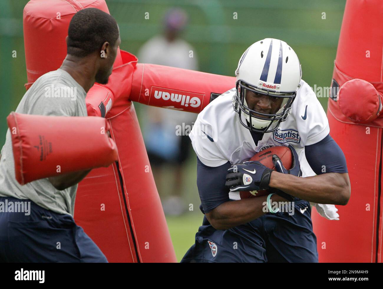 Tennessee Titans wide receiver Michael Preston, right, prepares to get hit with a blocking pad ...