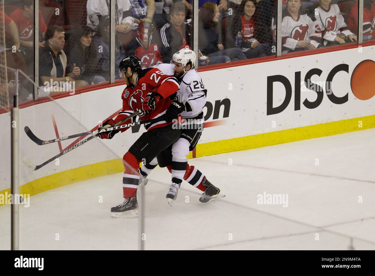 Los Angeles Kings center Jarret Stoll (28) checks New Jersey Devils ...