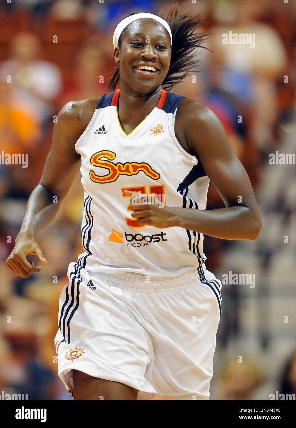Connecticut Sun's Tina Charles runs up court after scoring in the first ...