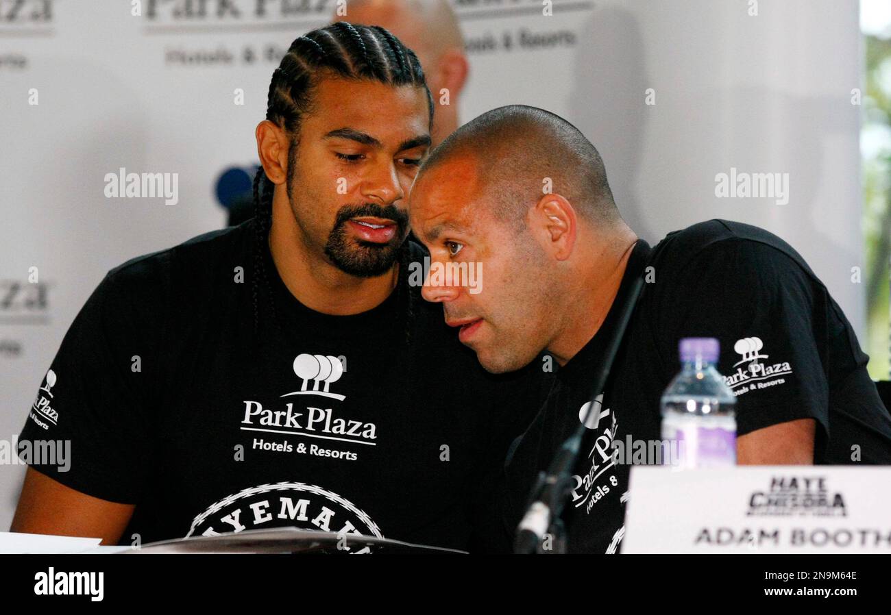 British boxer David Haye talks to his trainer Adam Booth, right, during ...
