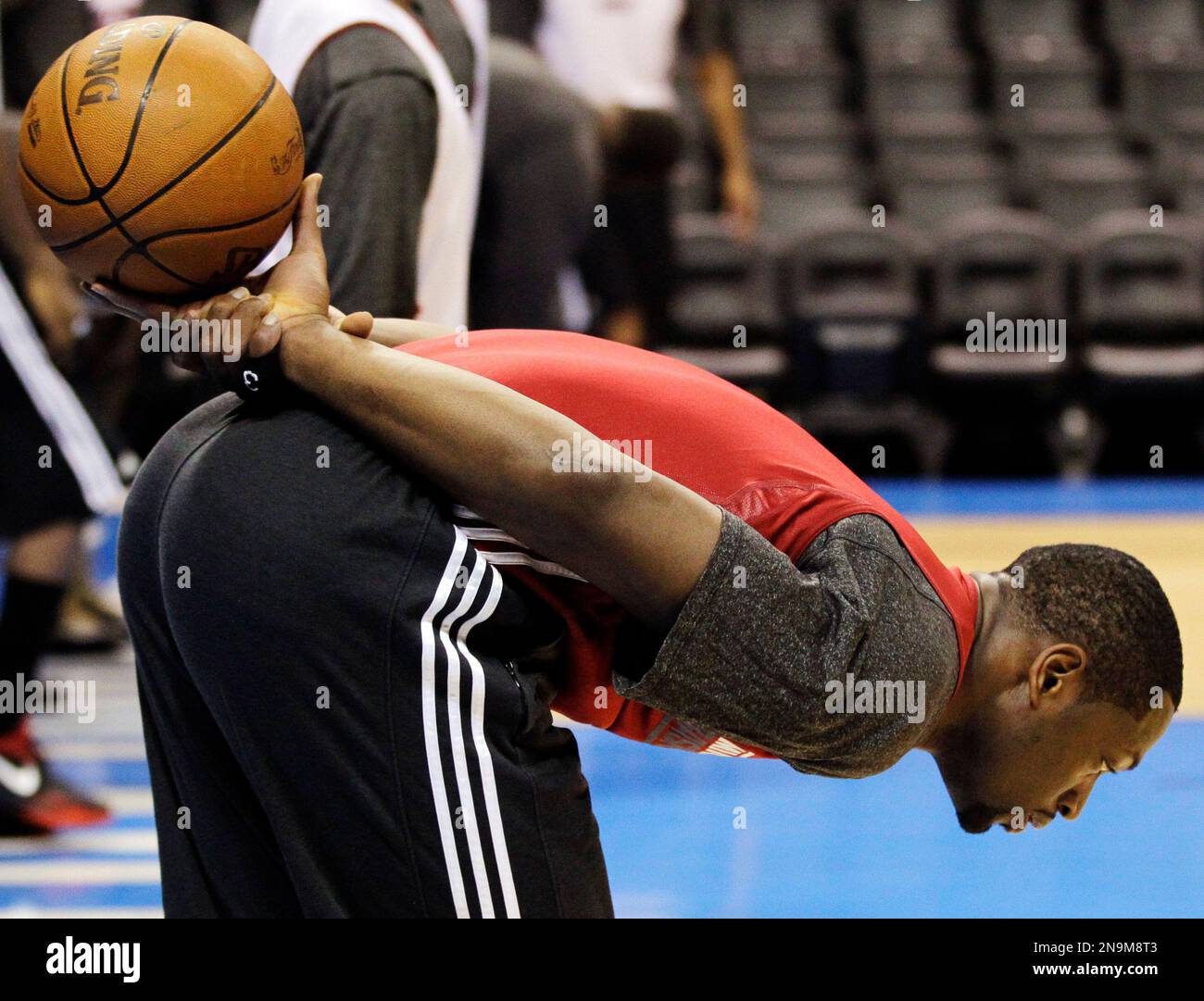 Miami Heat shooting guard Dwyane Wade stretches during practice, Monday ...