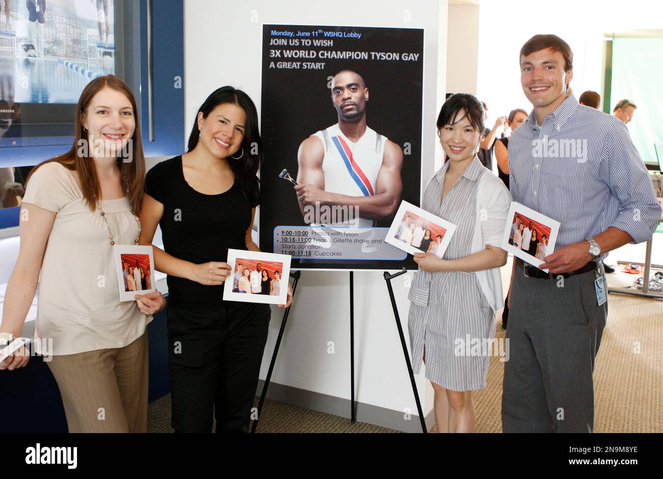 Gillette employees pose for photo after their picture taken with ...