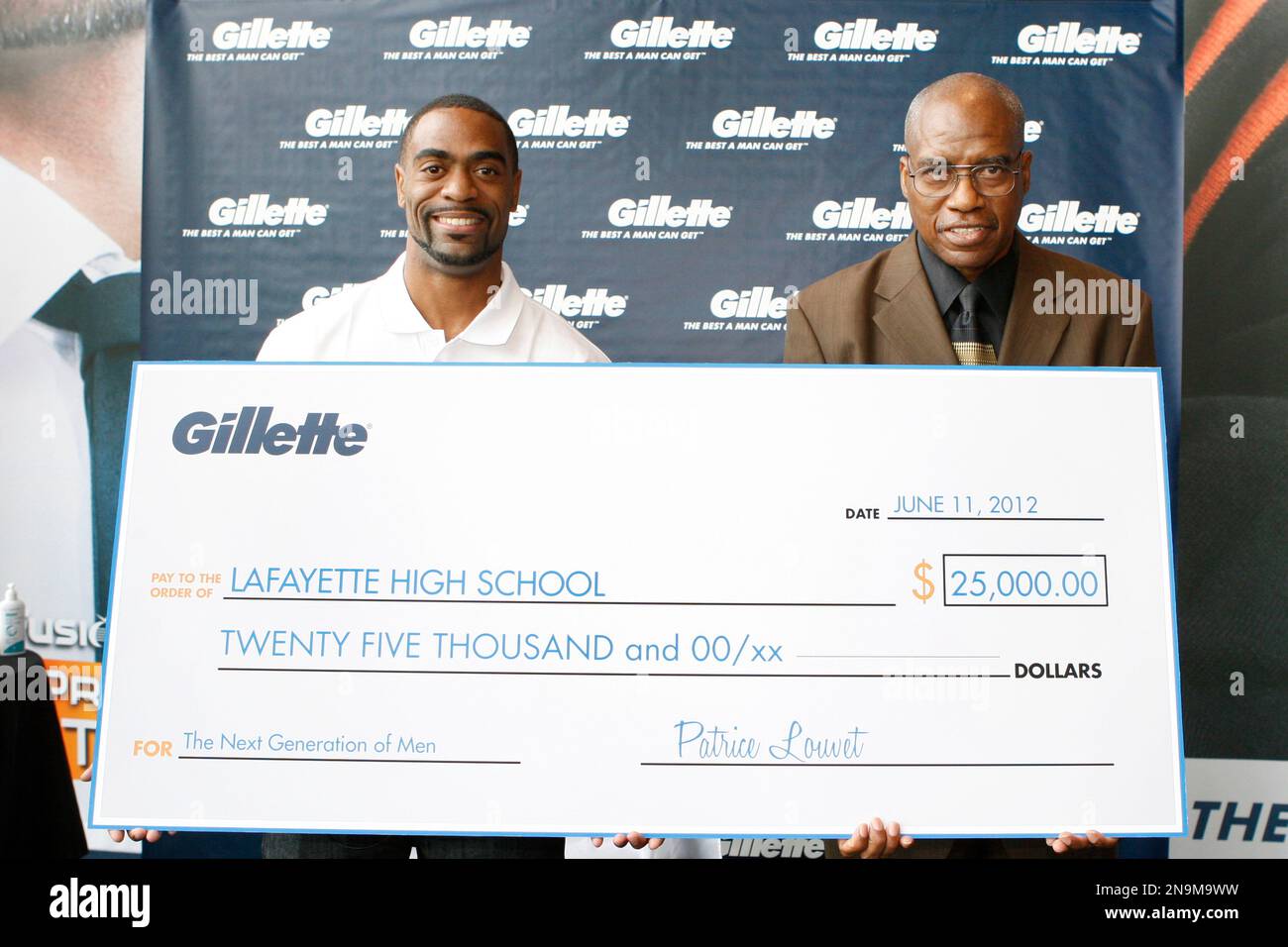 COMMERCIAL IMAGE - American 100m record holder Tyson Gay, left, present ...
