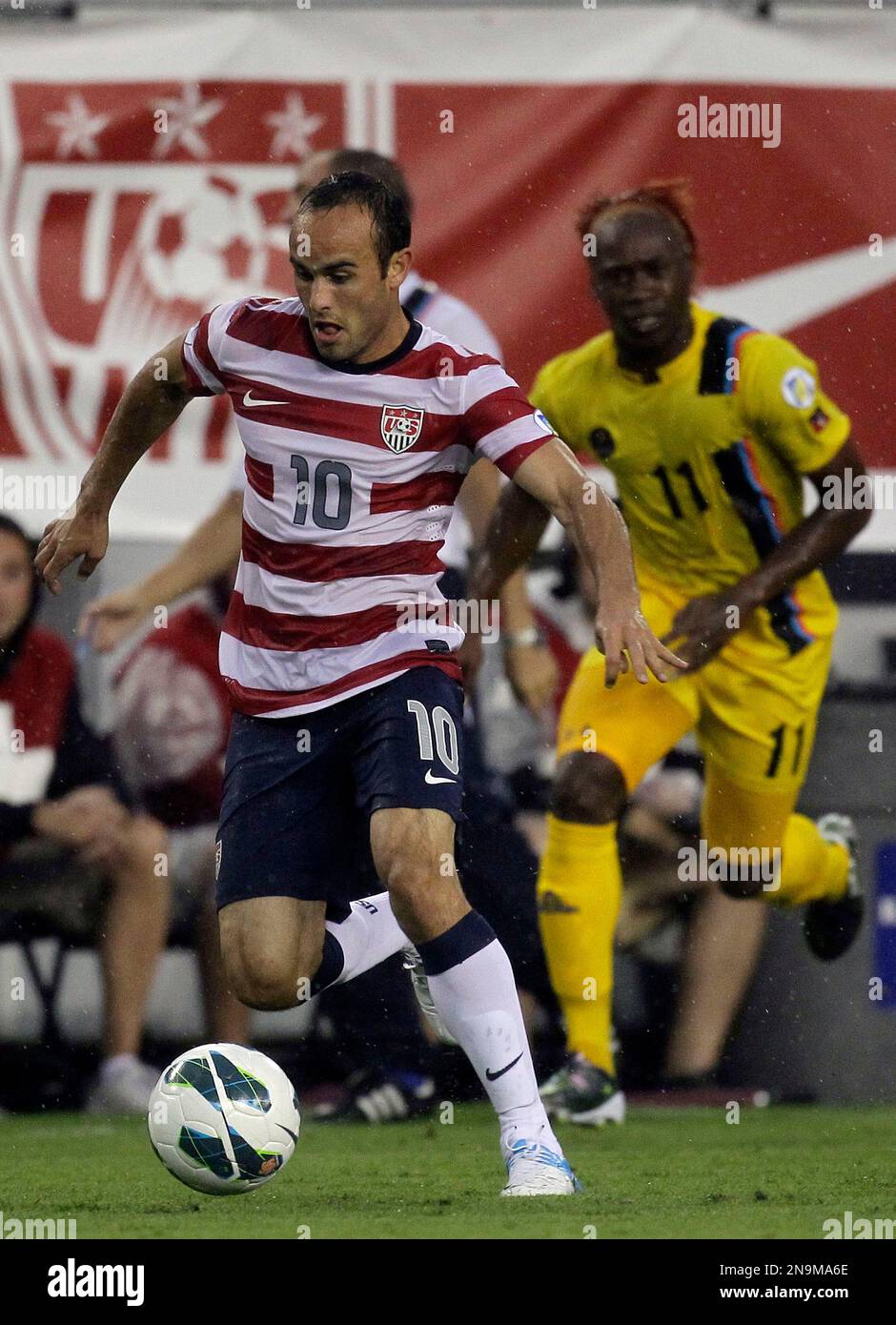 United States forward Landon Donovan gets by Antigua and Barbuda ...