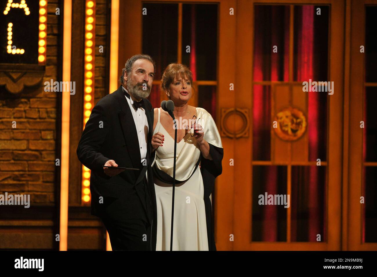 Mandy Patinkin, left, and Patti LuPone present an award at the 66th ...