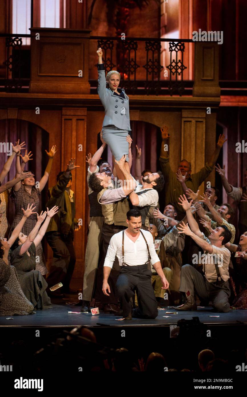 Ricky Martin and Elena Roger perform with the cast of "Evita" at the ...