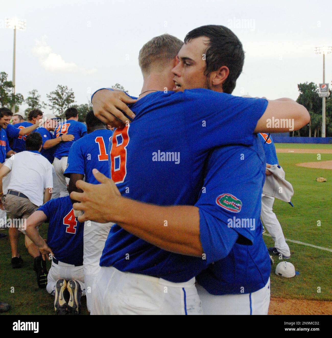 Florida's Preston Tucker, right, embraces Daniel Pigott (8) after ...