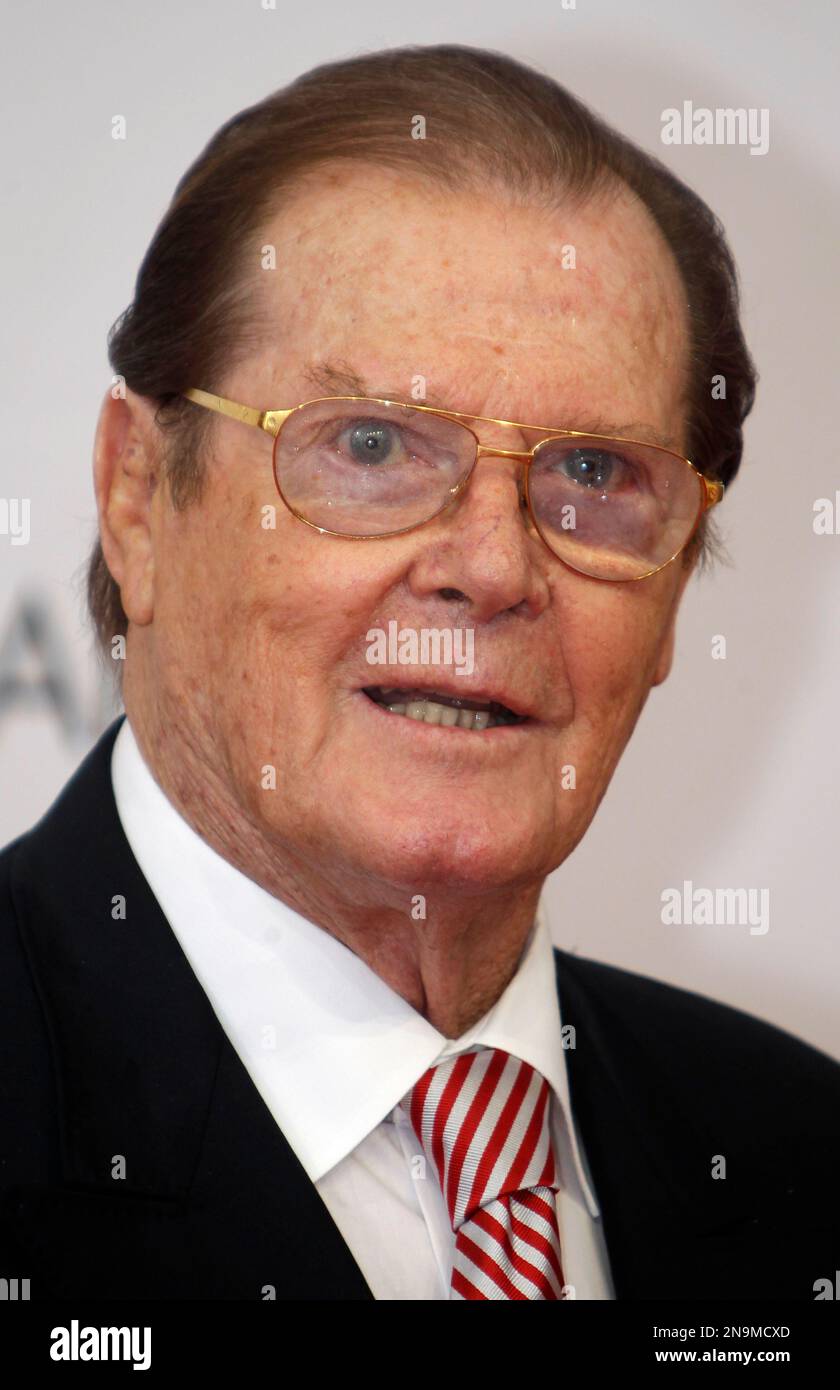 British actor Roger Moore poses during the opening ceremony of the 2012 ...