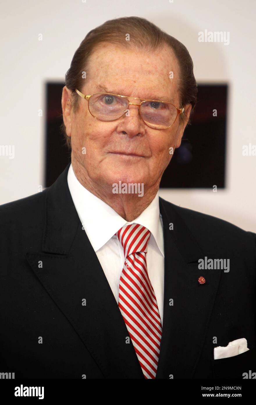 British actor Roger Moore poses during the opening ceremony of the 2012 ...