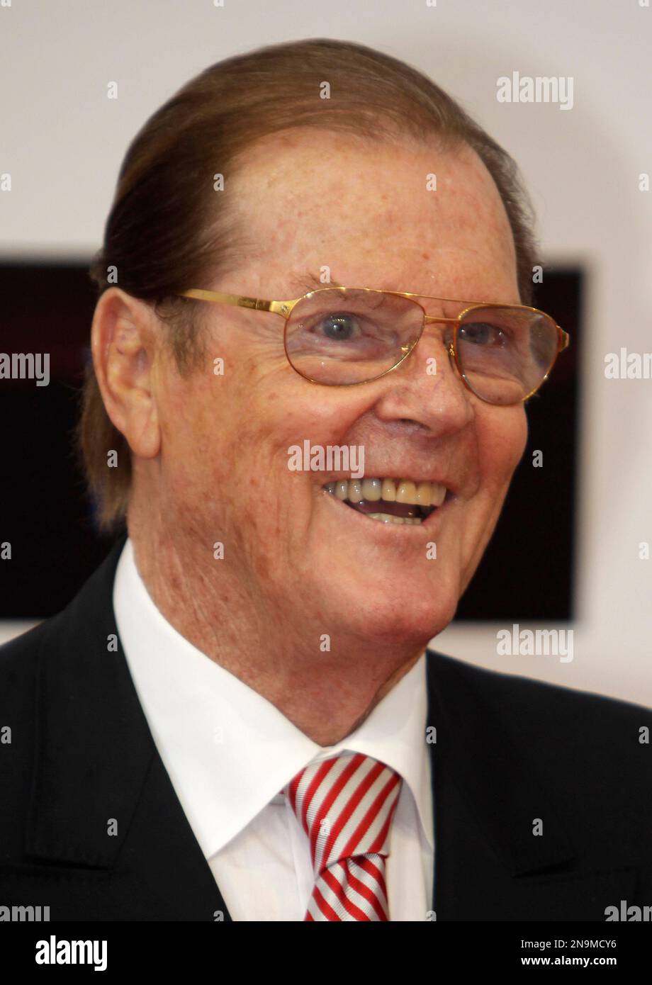 British actor Roger Moore poses during the opening ceremony of the 2012 ...