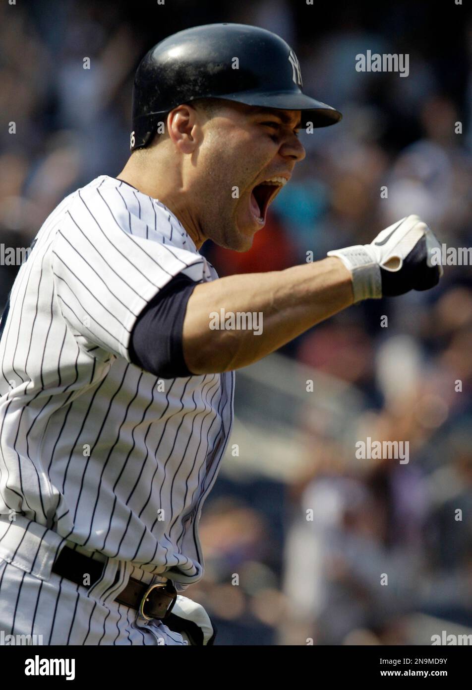 New York Yankees' Russell Martin reacts after hitting a game-winning ...