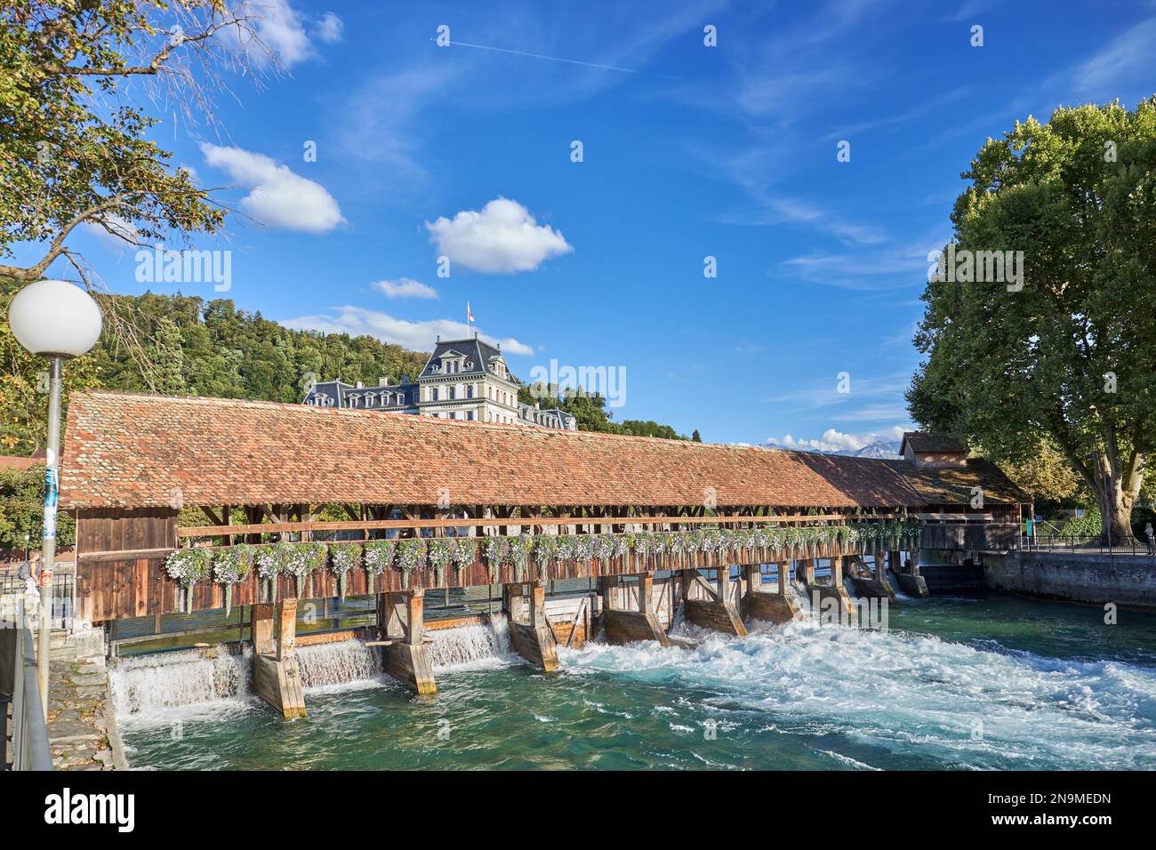 A View of the covered wooden bridge in the city of Thun, Switzerland ...