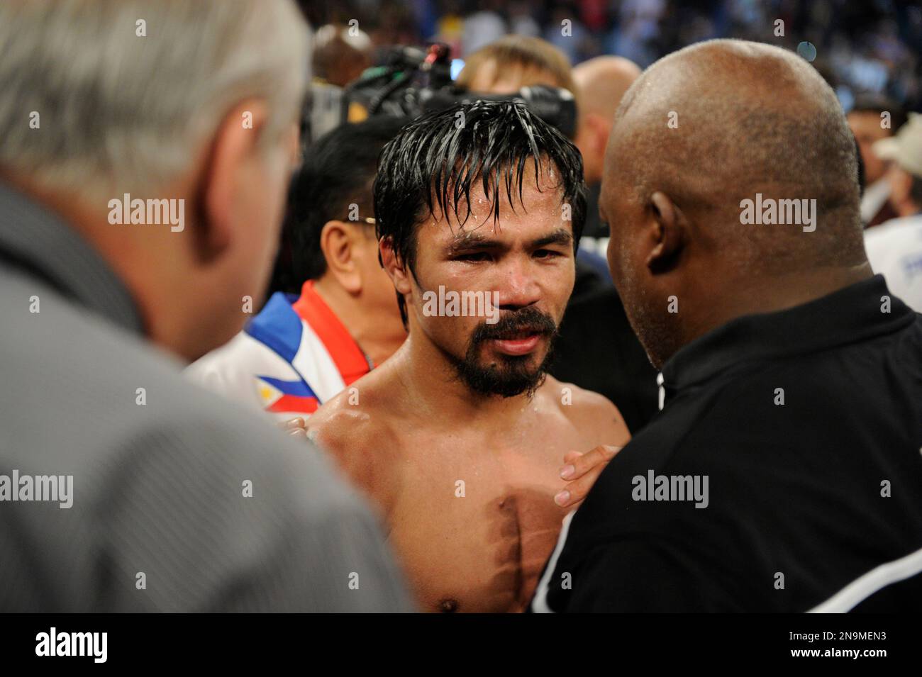 Manny Pacquiao talks to a member of Team Bradley following his WBO ...