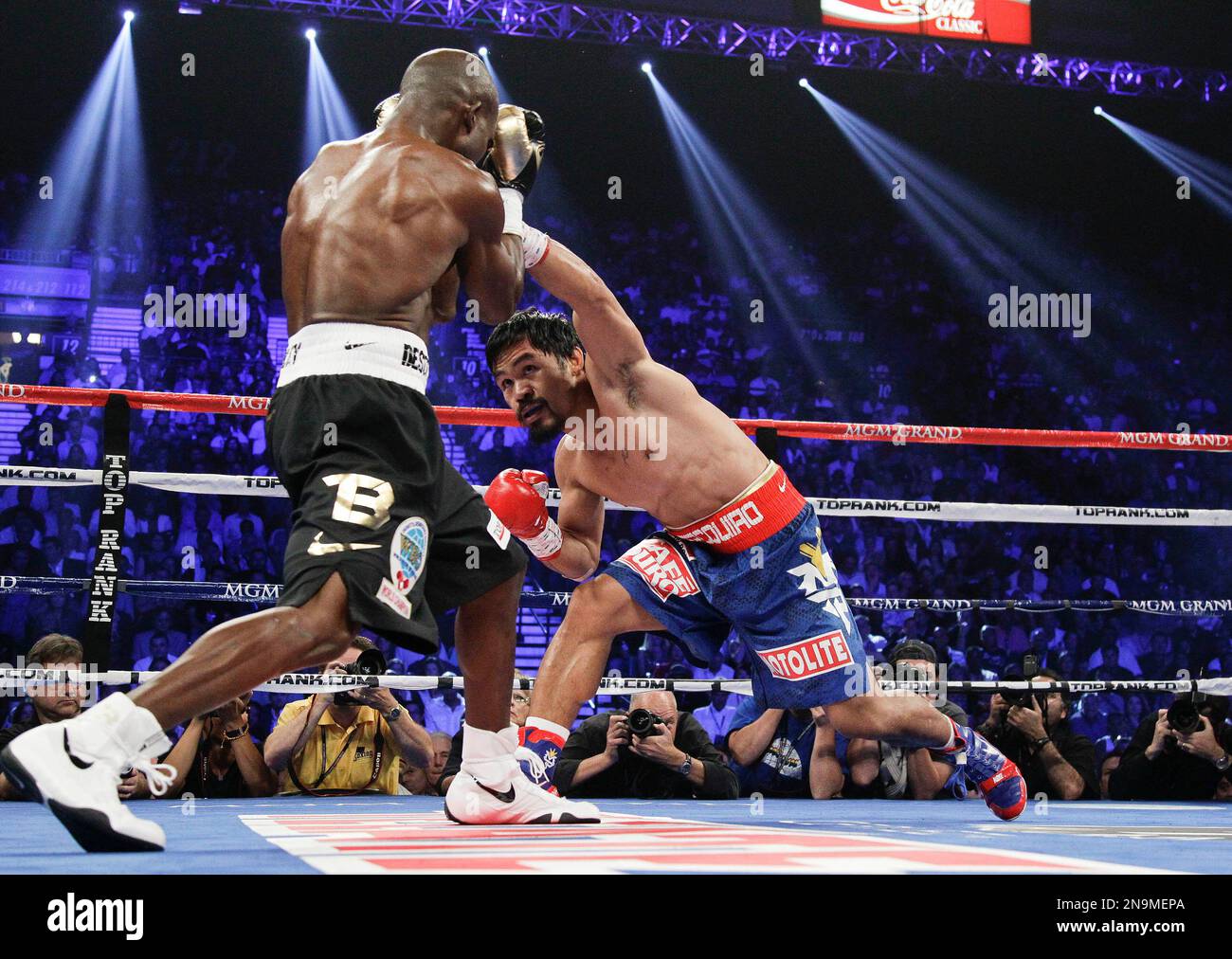 Manny Pacquiao throws a punch against Timothy Bradley in the first ...
