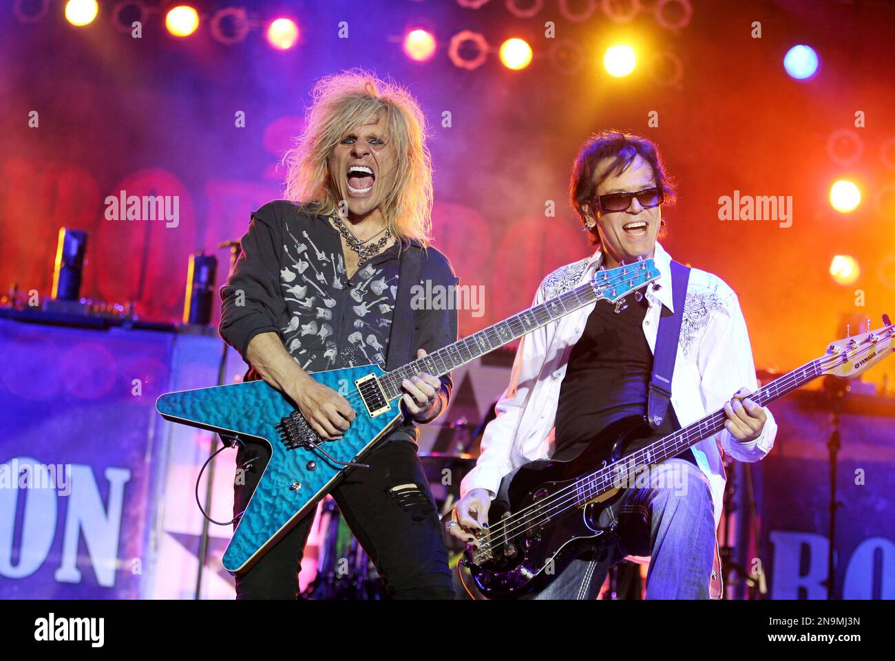 C.C. DeVille, left, and Bobby Dall perform with the band Poison at the ...