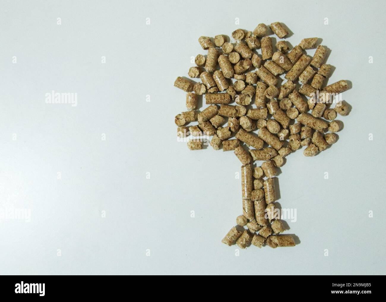 A closeup of pellet in the shape of a tree on a white background Stock ...