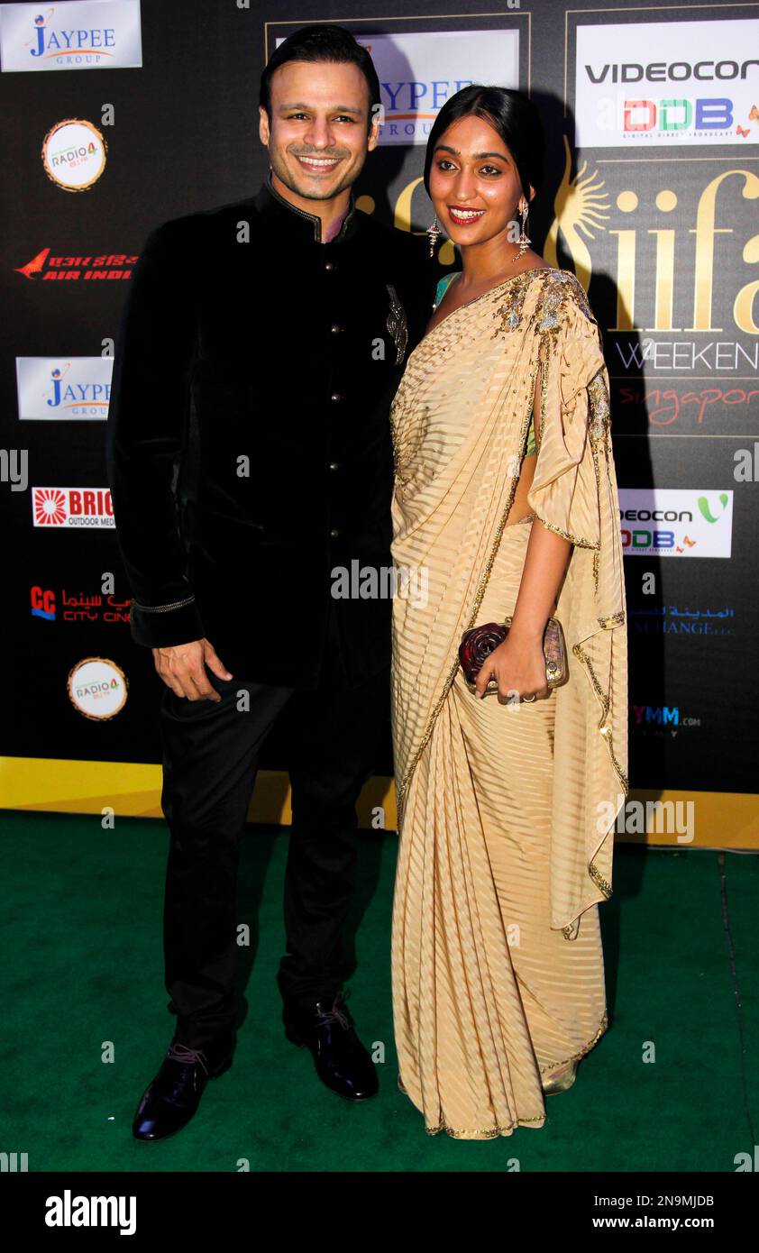 Bollywood actor Vivek Oberoi, left, and his wife Priyanka, arrive on ...