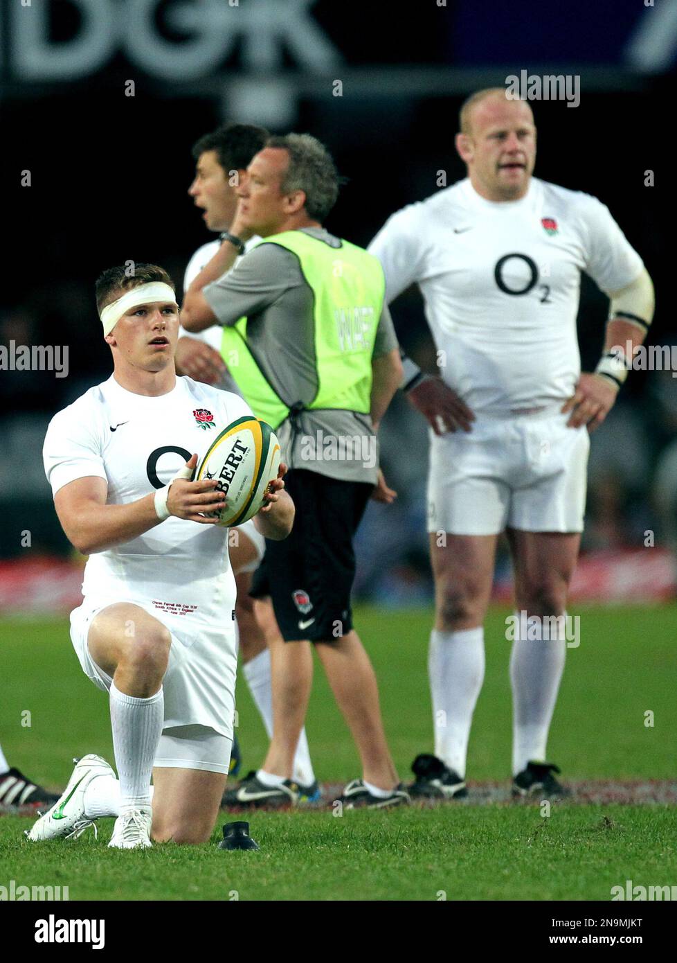 England's Owen Farrell, left, prepares to kick a penalty during their ...